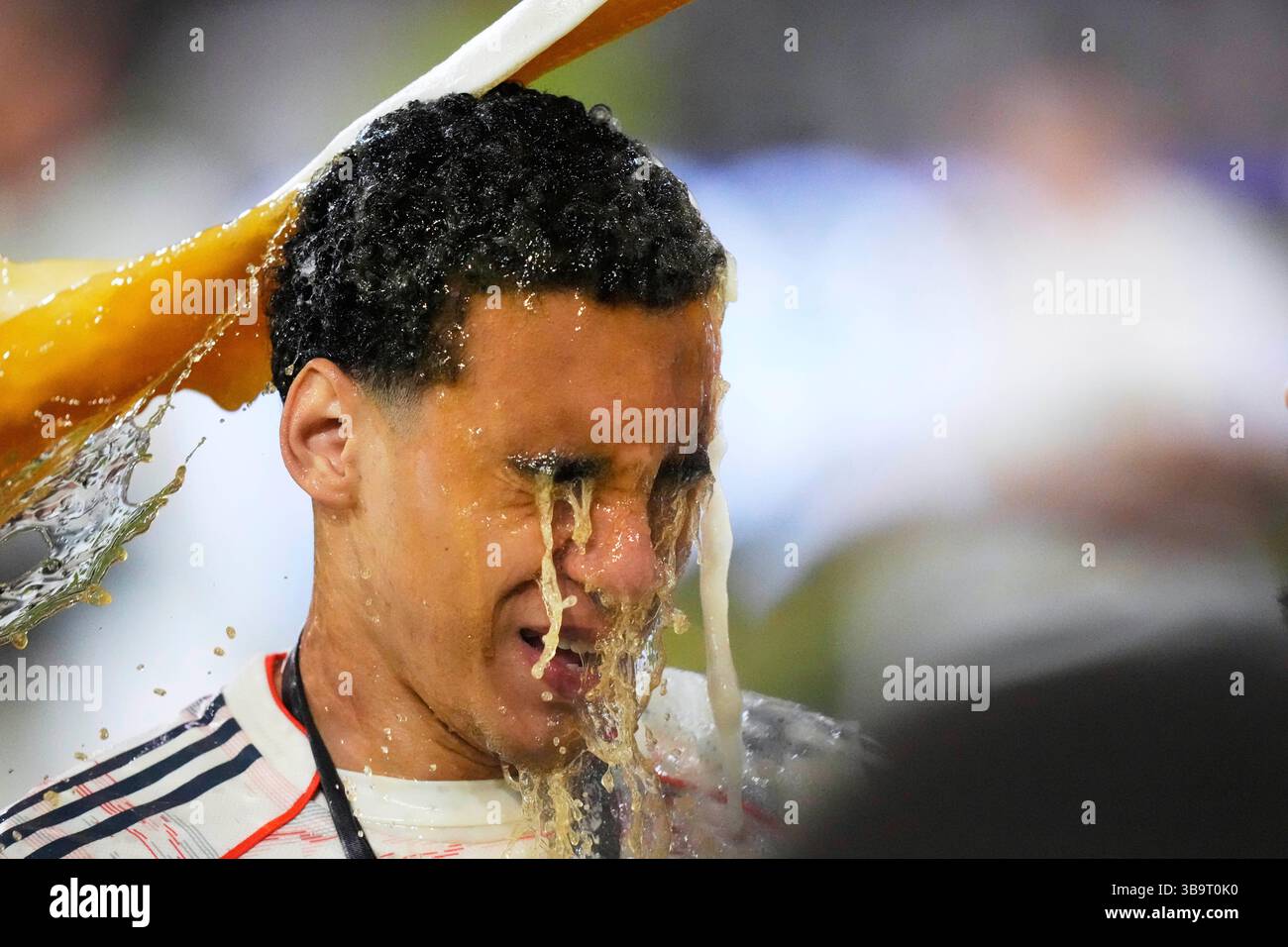 Bayern's Jamal Musiala is doused with beer after the German Bundesliga ...