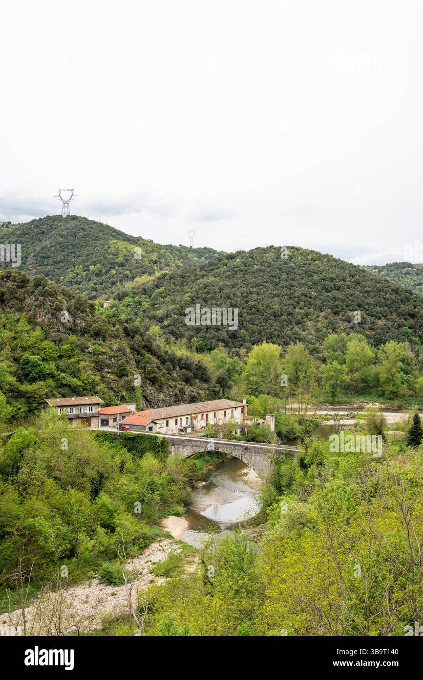Landscape with a medieval bridge over the Duzon river, Ardeche, France ...