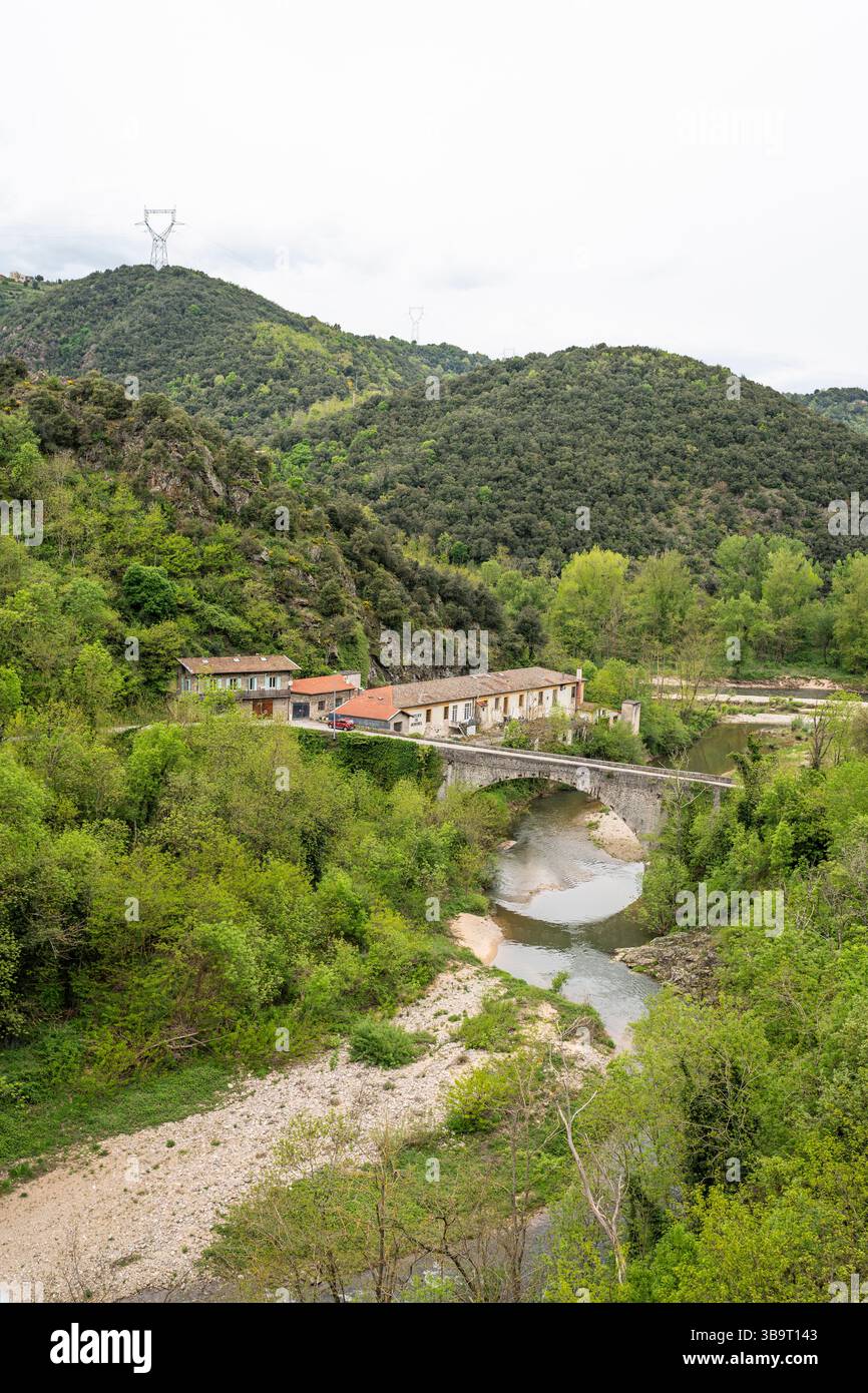 Landscape with a medieval bridge over the Duzon river, Ardeche, France ...