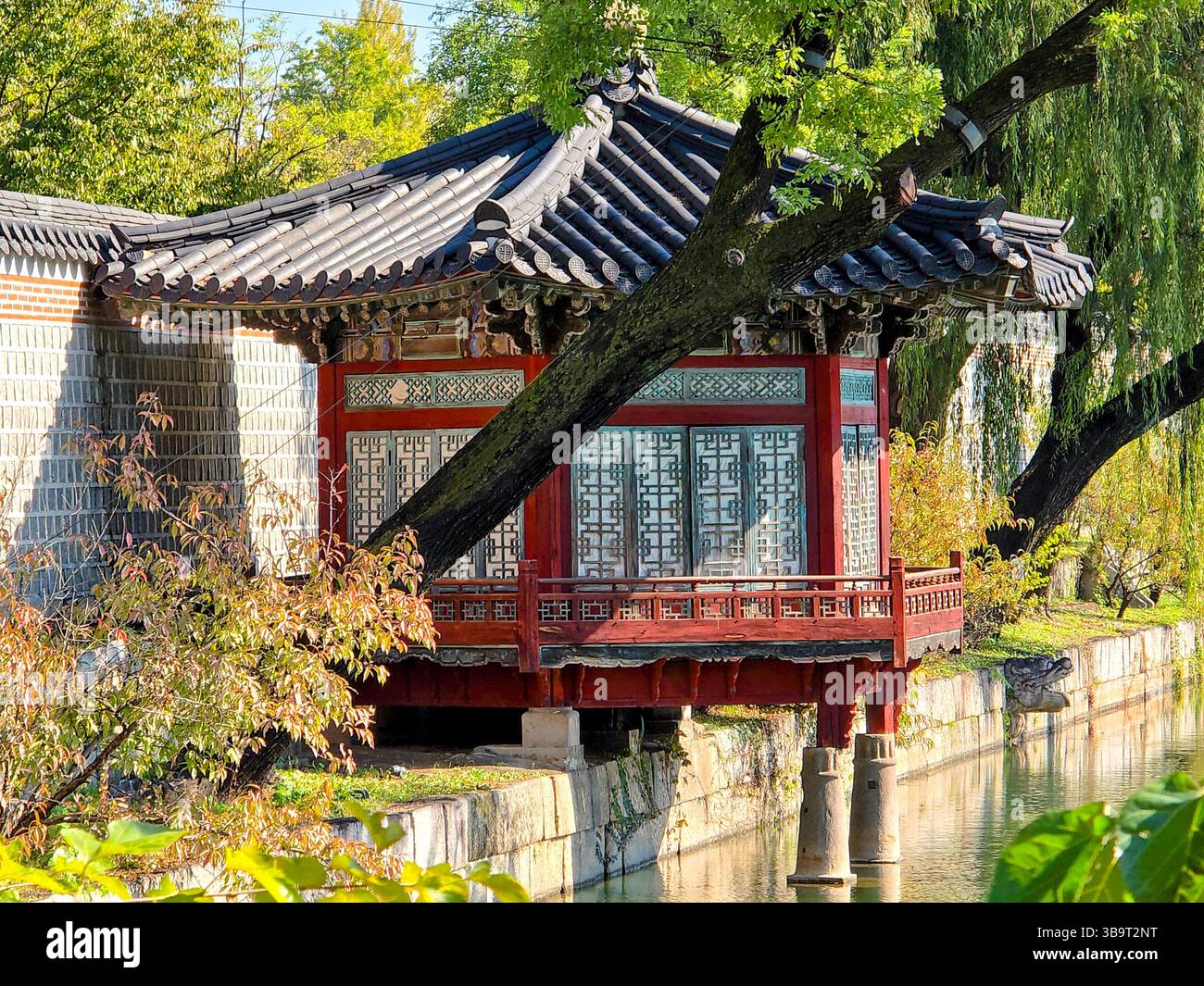 Traditional Korean wooden pavilion with ornate lattice windows and ...