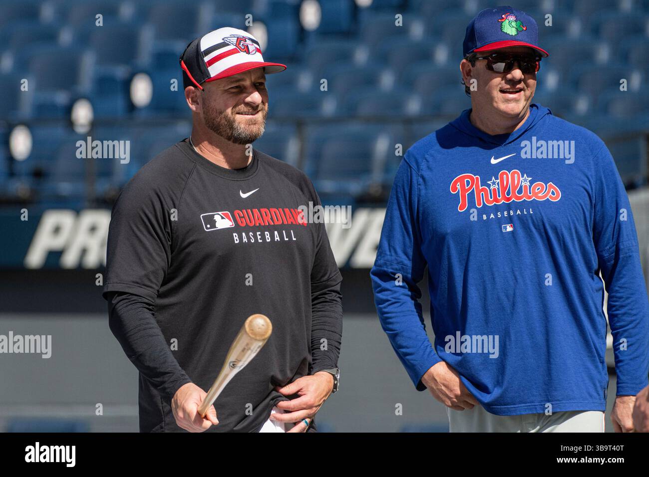 Cleveland Guardians manager Stephen Vogt, left, and Philadelphia ...