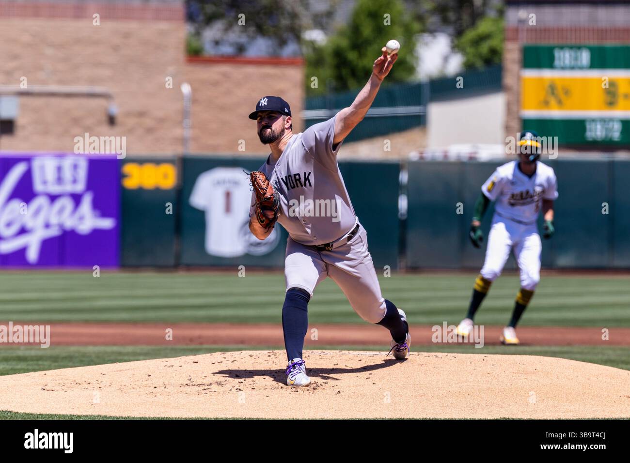 New York Yankees pitcher Carlos Rodón (55) throws to the Athletics ...