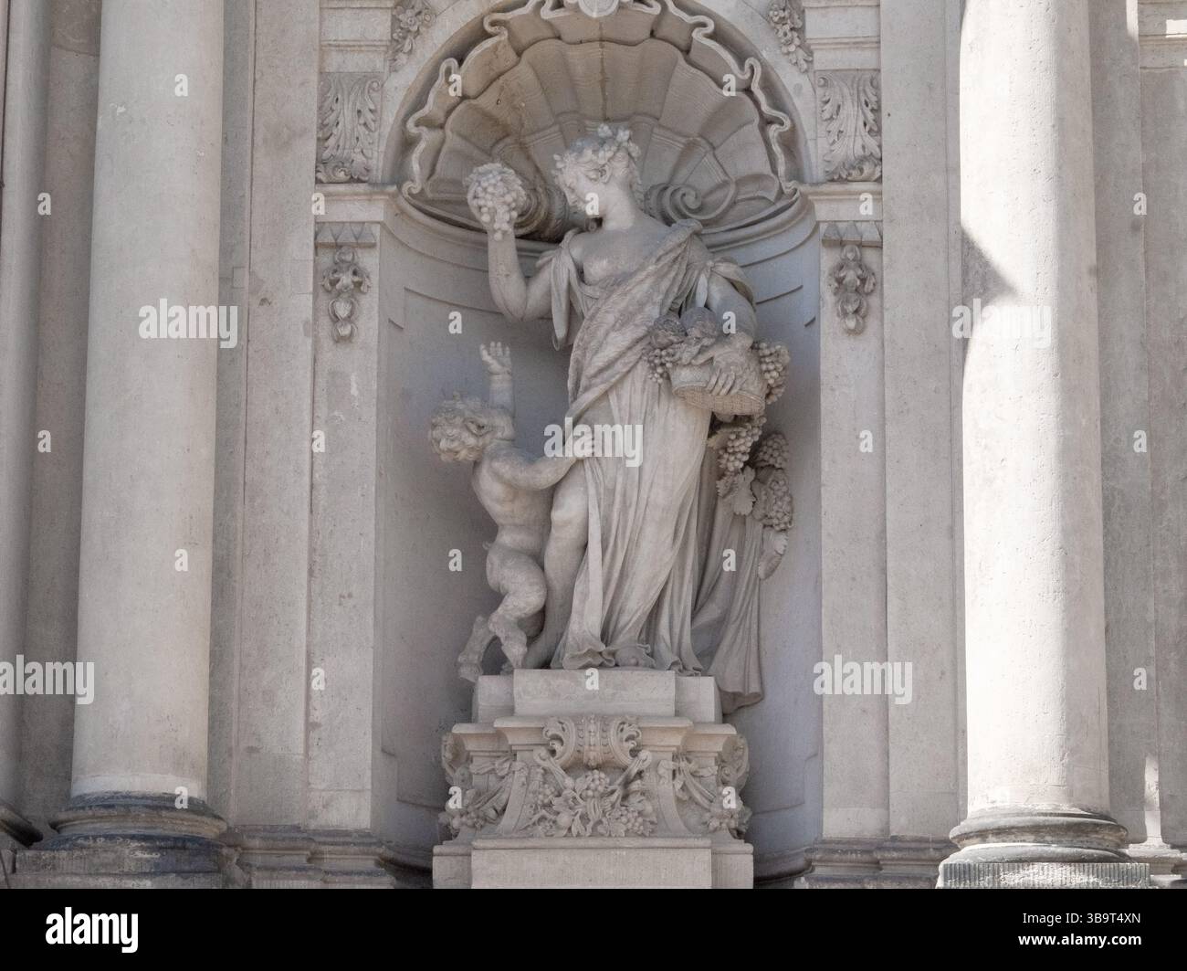 A white stone Baroque statue of the Roman goddess of flowers and spring ...