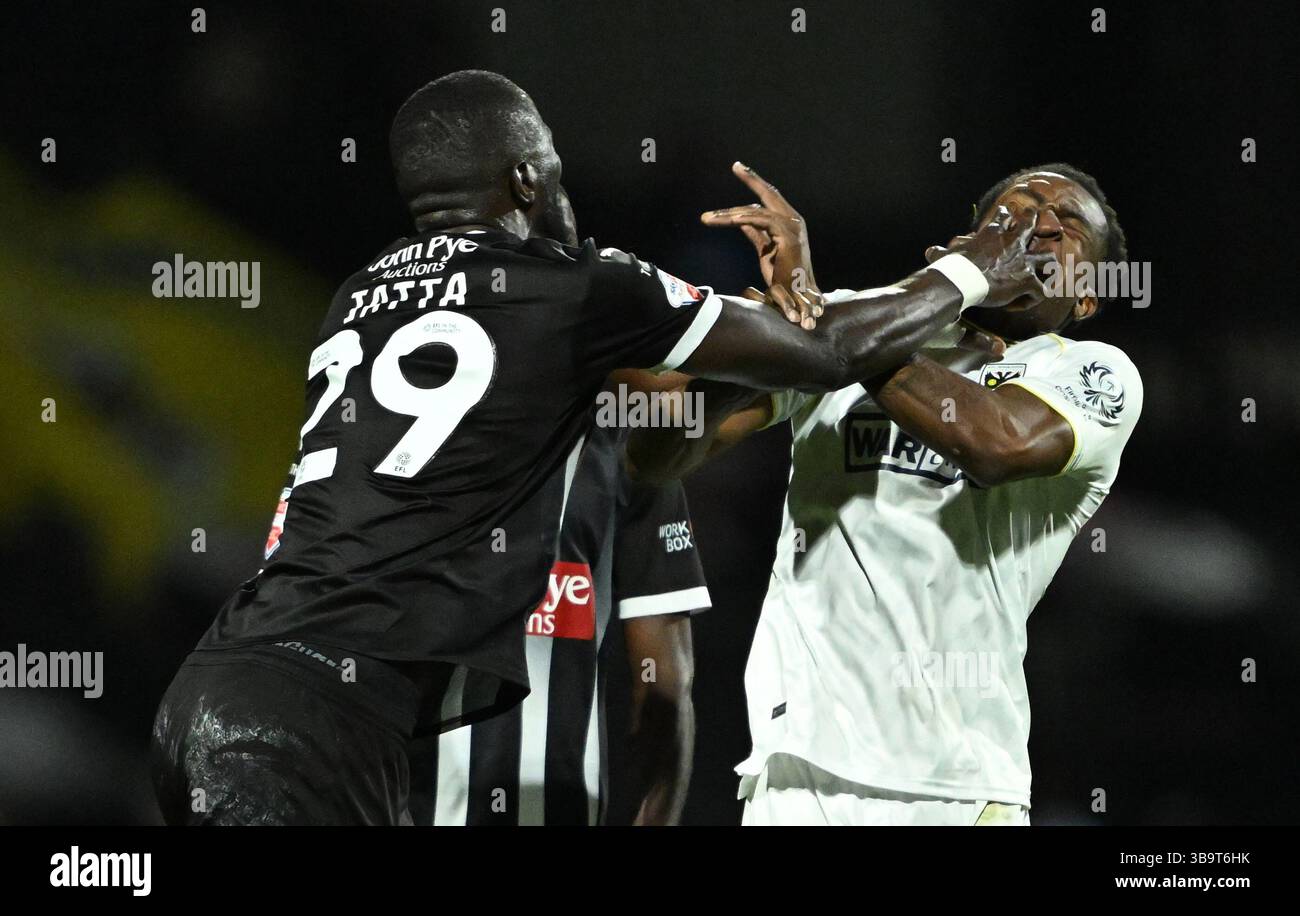 Notts County's Alassana Jatta (left) reacts to AFC Wimbledon's Josh ...