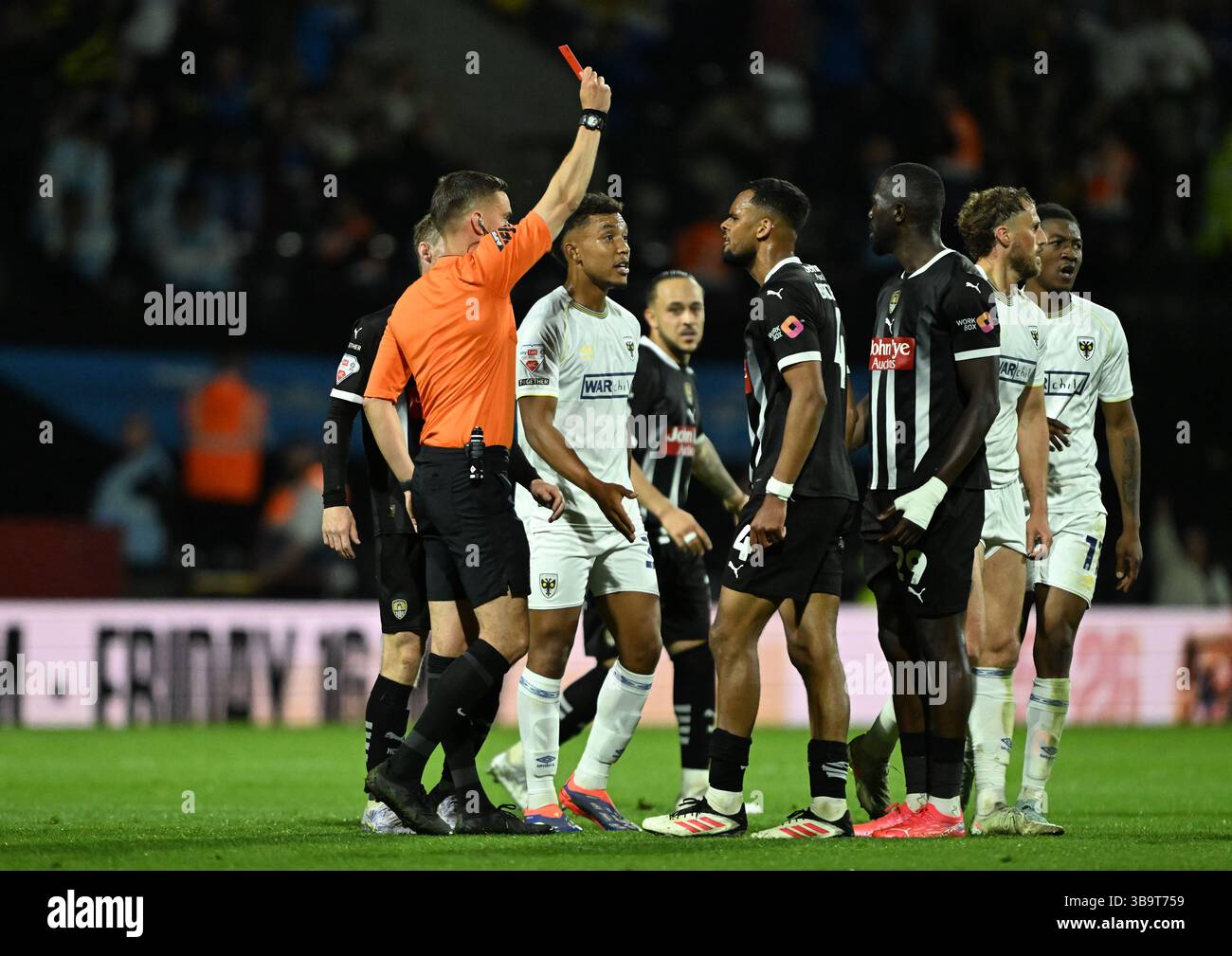 Notts County's Alassana Jatta (third right) is shown a red card by ...