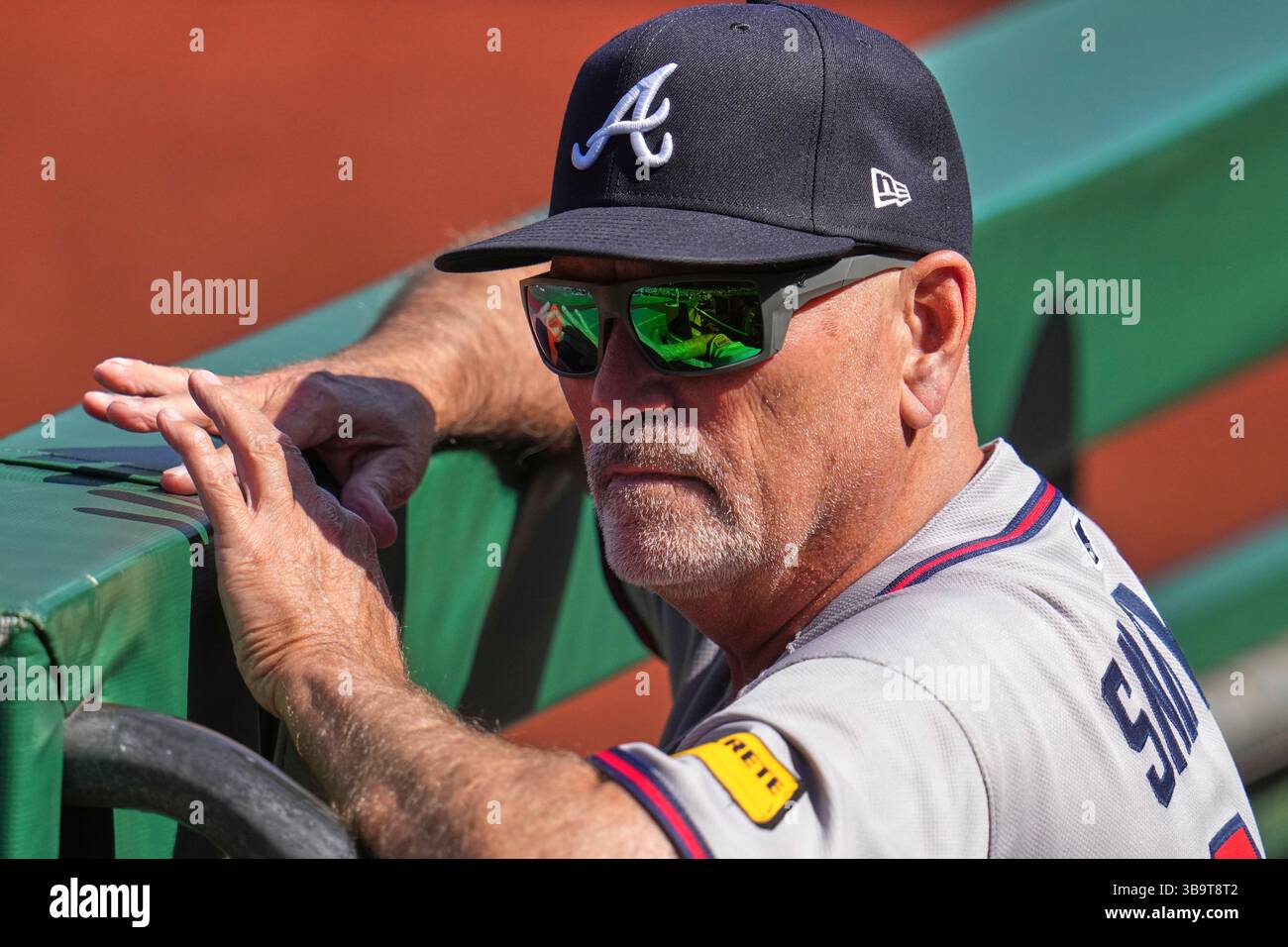 Atlanta Braves manager Brian Snitker stands in the dugout before a ...