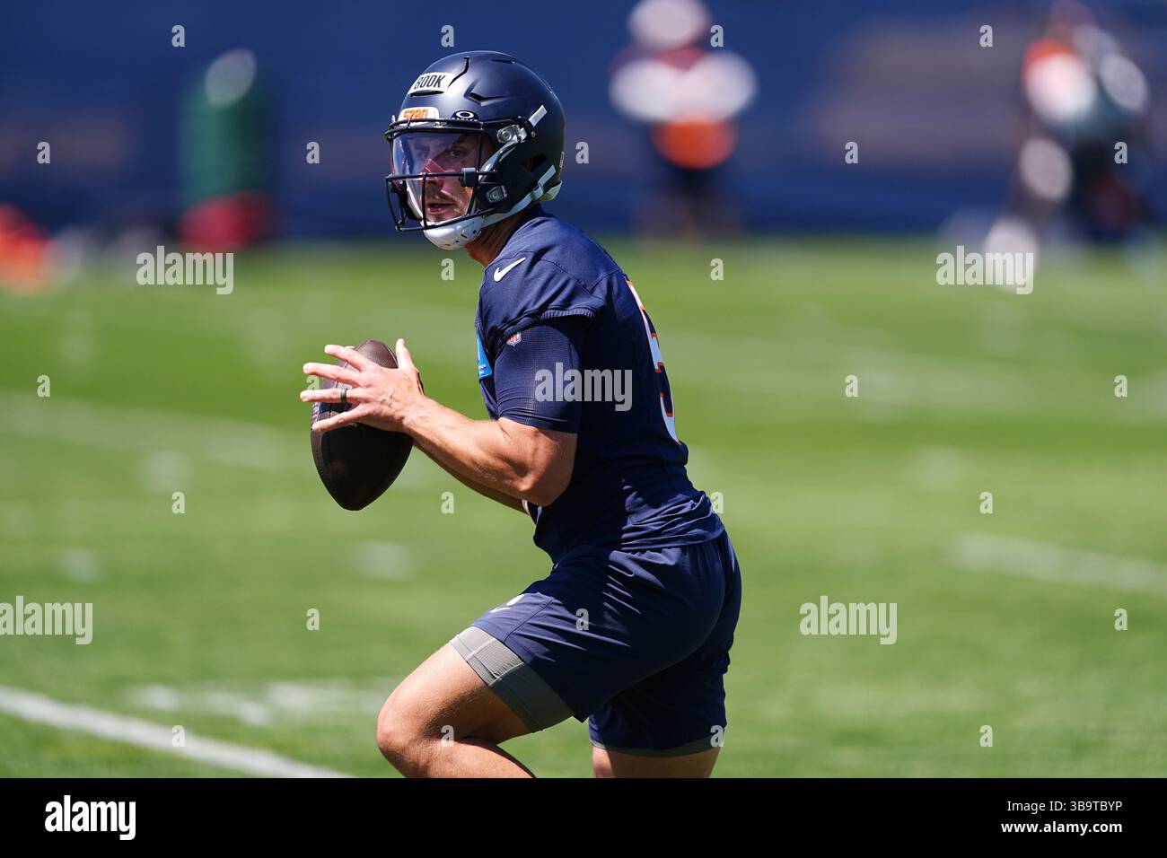 Denver Broncos quarterback Ian Book takes part in drills during the NFL ...