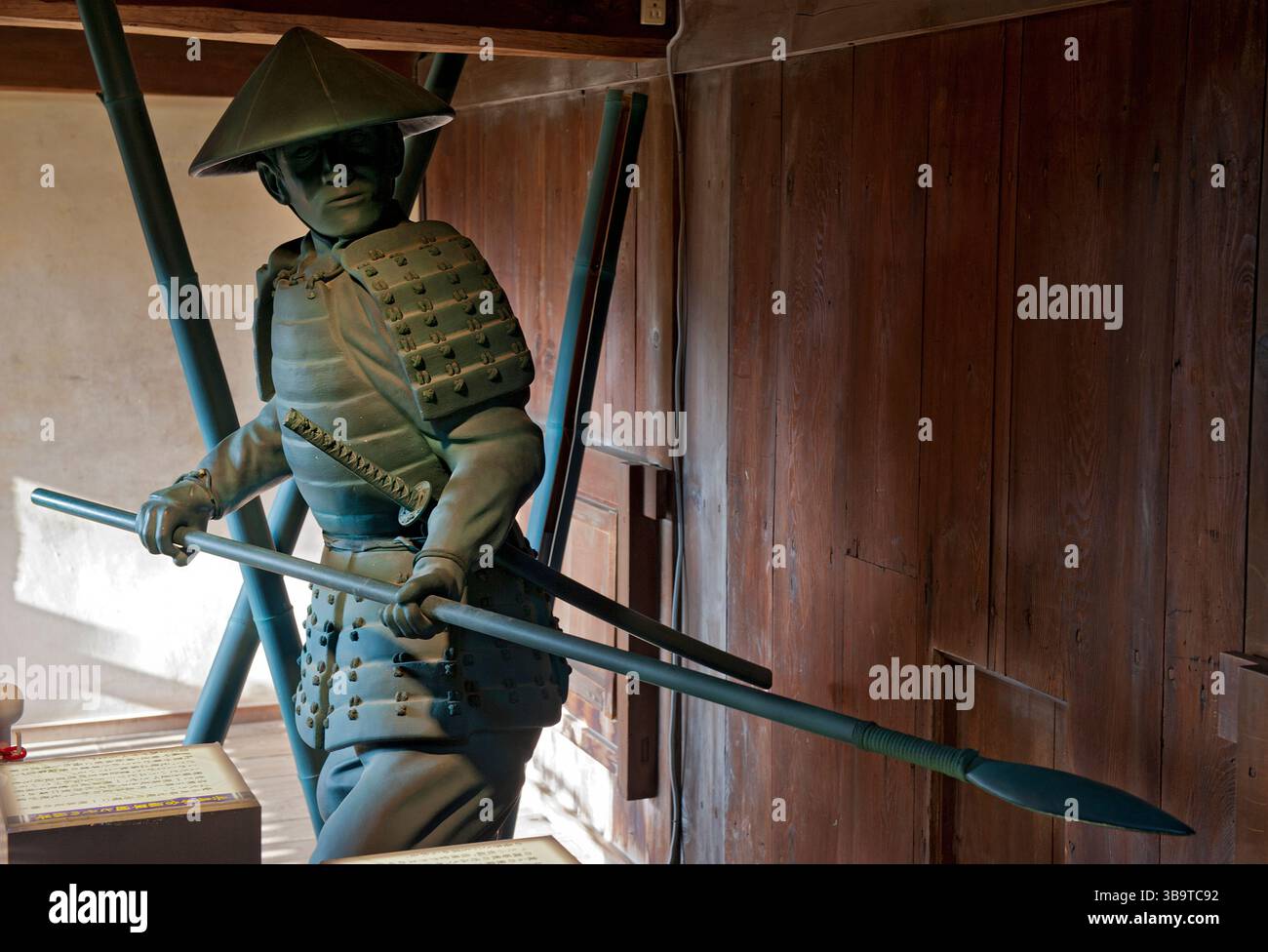 Bronze statue of a historic castle defender soldier wearing armor ...
