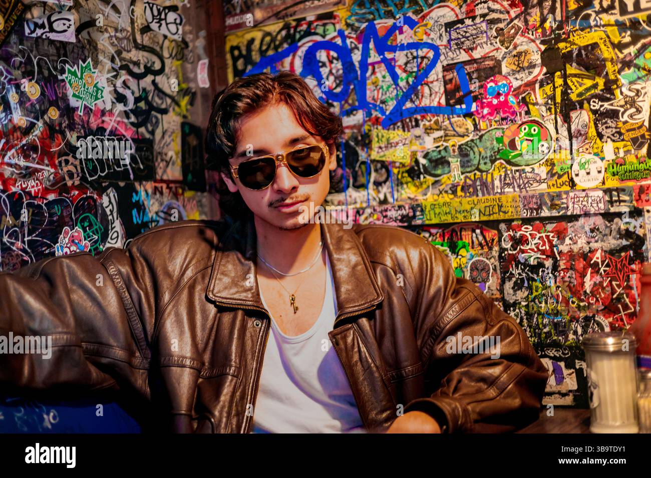 Mr. Pablo with glasses posing in an urban bar Stock Photo - Alamy