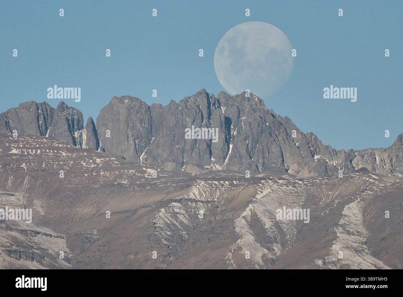 The moon rises over the Andes in Santiago, Chile, Saturday, May 10 ...