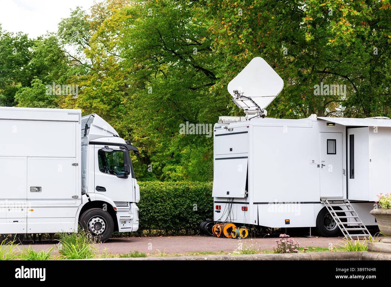 Many modern white mobile digital electric tv broadcasting trucks ...