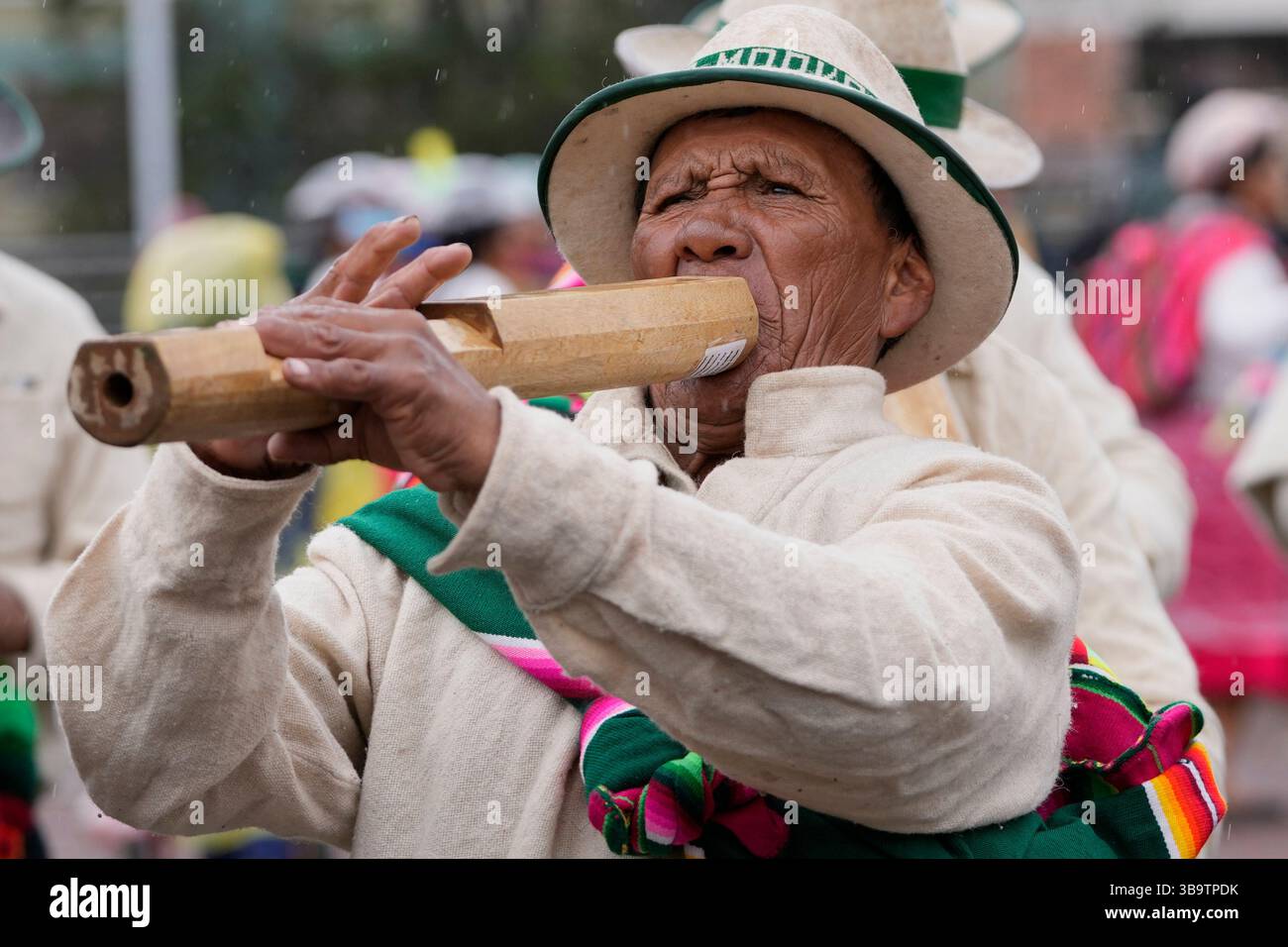 An Aymara Indigenous musician plays a "Tarqa," a traditional Andean ...