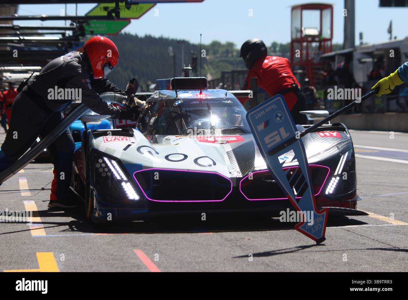 #93 PEUGEOT TOTALENERGIES driver MIKKEL JENSEN (DNK) high-fives a young ...