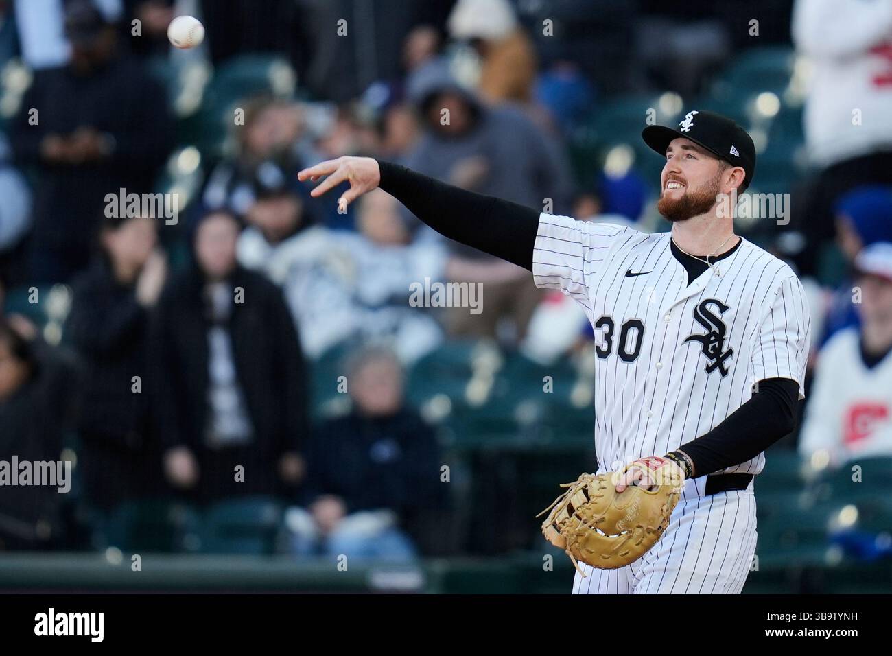 Chicago White Sox first baseman Tim Elko warms up before a baseball ...