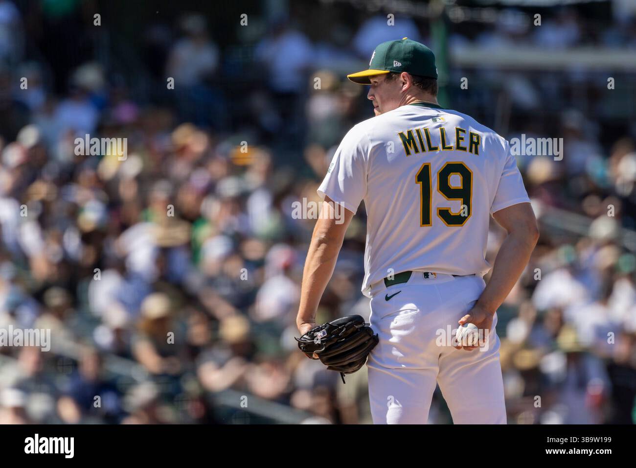 Athletics pitcher Mason Miller (19) looks to the catcher during the ...
