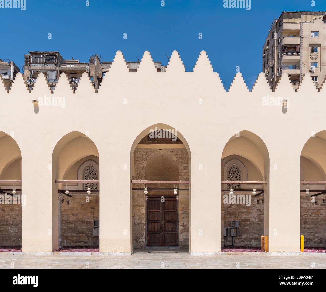Visitors admire the architectural beauty of the courtyard of Mosque of ...