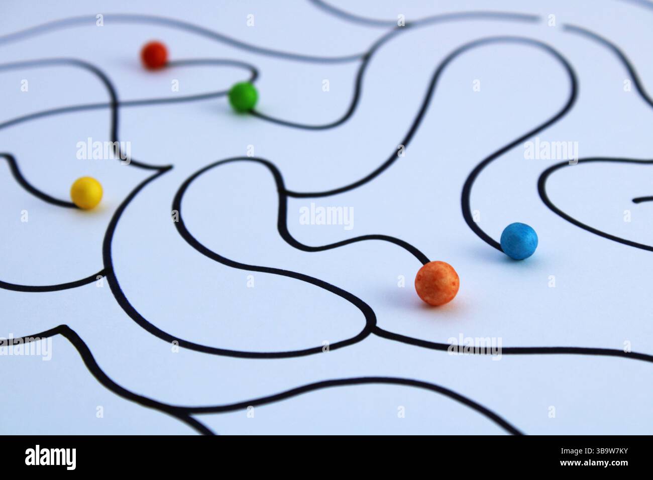 Colorful spheres team members take different paths Stock Photo - Alamy