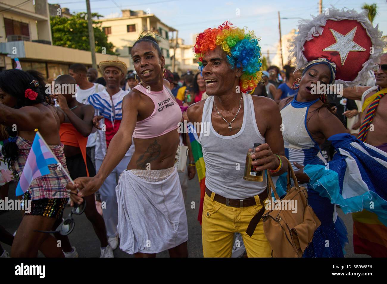 Members of the LGBTQ+ community dance during a Gay Pride march in ...