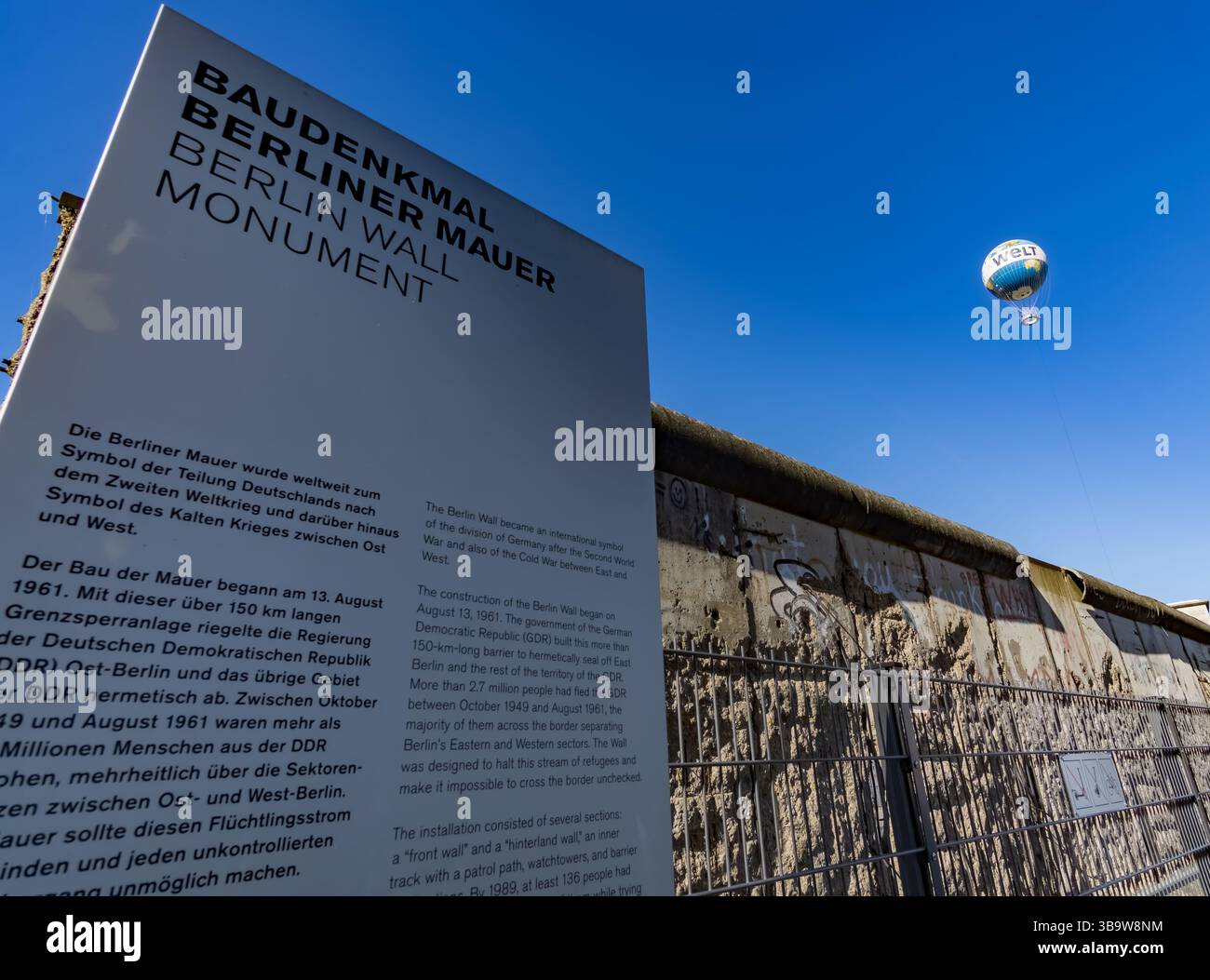 Informational sign at the Berlin Wall Memorial with original Wall ...