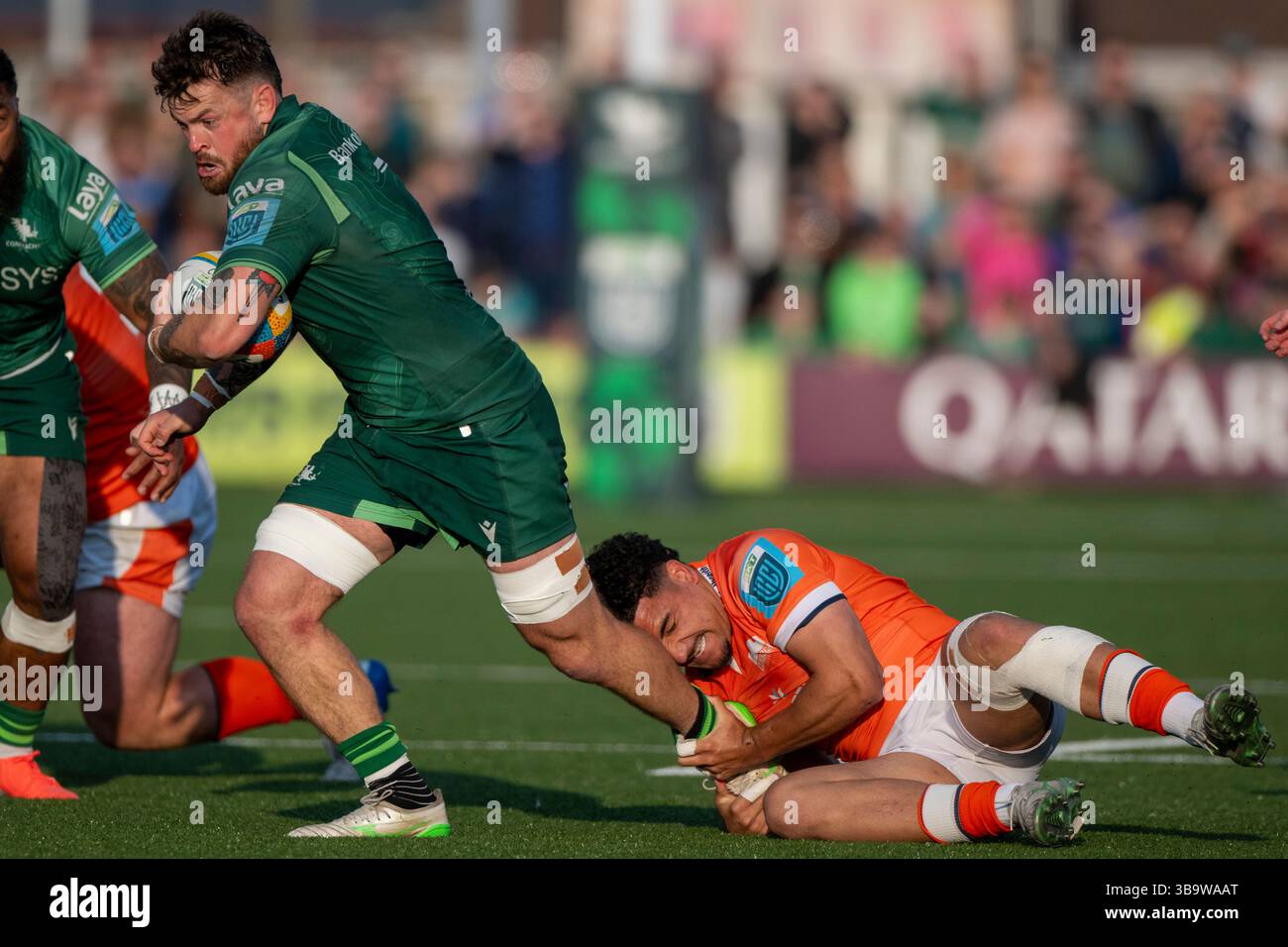 Conor Oliver of Connacht tackled by Mosese Tuipulotu of Edinburgh ...