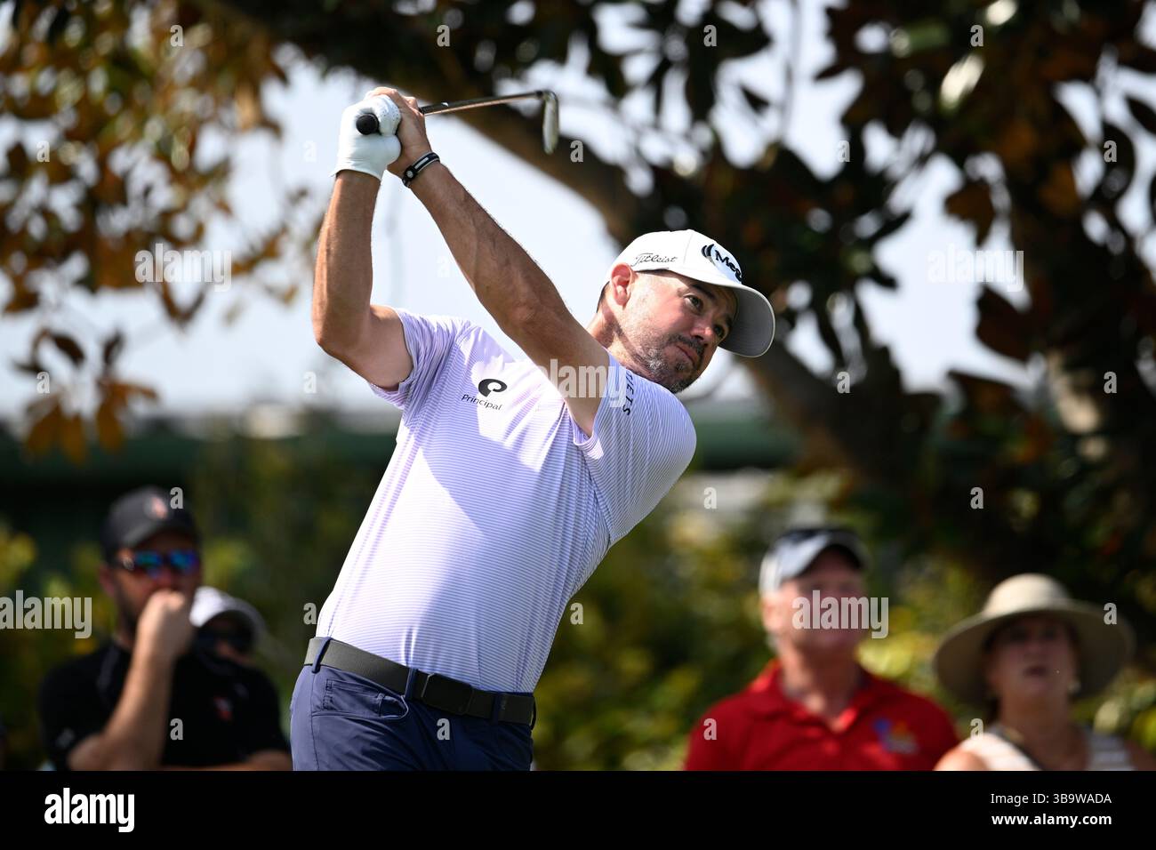 Brian Harman looks on after hitting his tee shot on the second hole ...