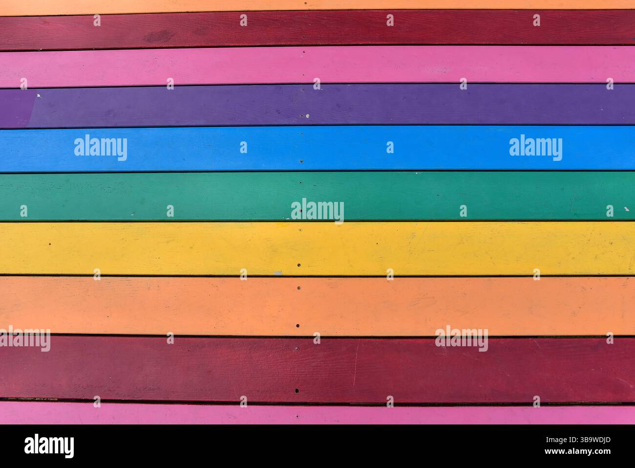 Colorful Wooden Plank Floor with Rainbow Pattern - The image captures a ...