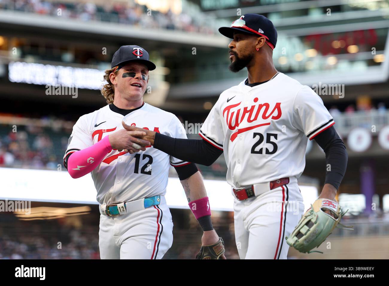 Minnesota Twins outfielder Harrison Bader (12) and outfielder Byron ...