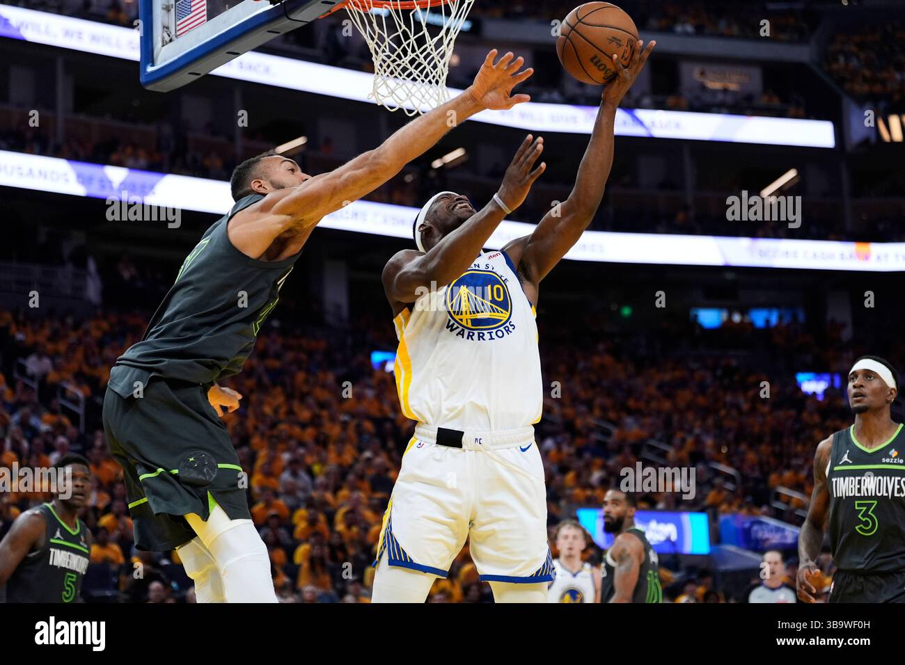 Golden State Warriors forward Jimmy Butler III (10) shoots while defended by Minnesota ...