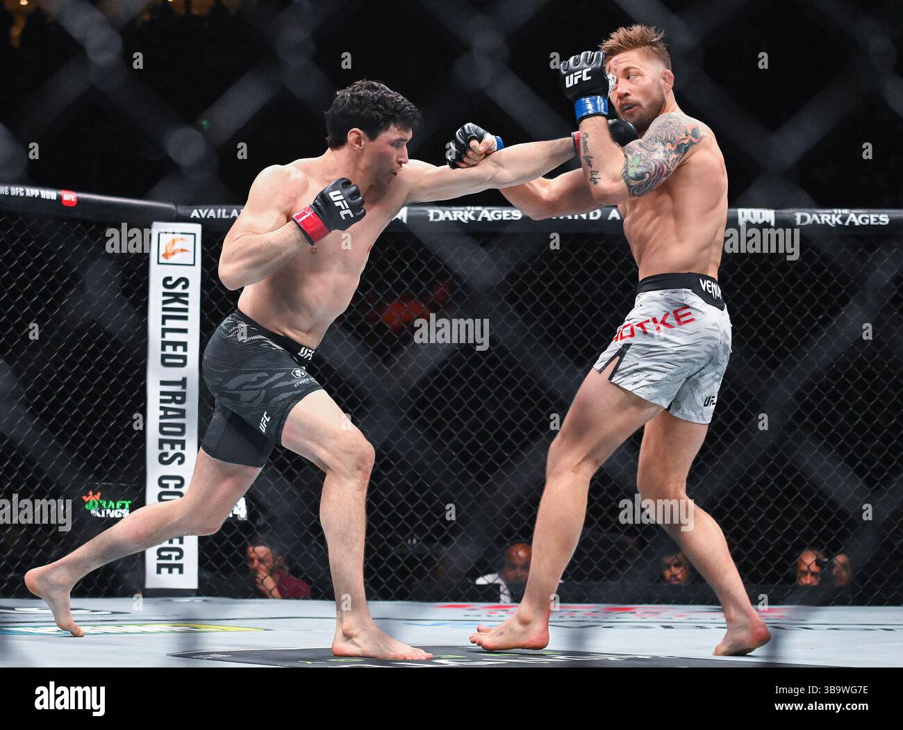 Montreal, Canada. 10th May, 2025. Mike Malott, left, lands a blow to ...