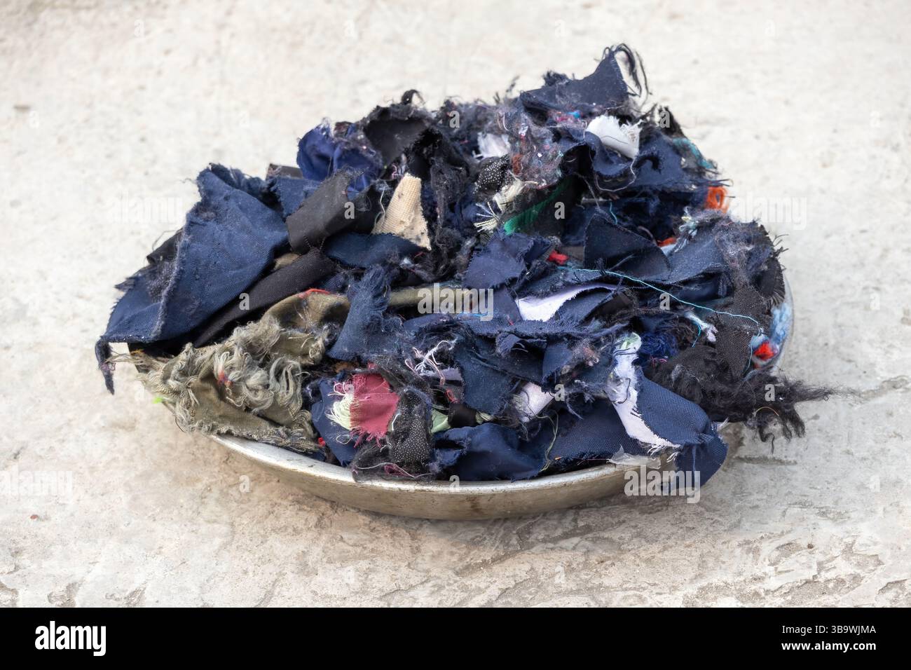 Pile of waste textile fabric pieces. Cotton recycled from these old ...