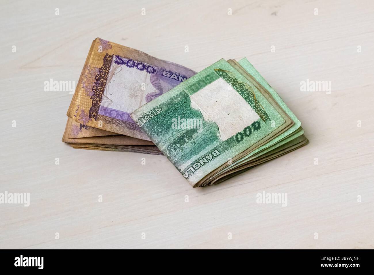 Folded BDT 1000 Tk and 500 Tk Bangladesh currency banknotes (totaling ...