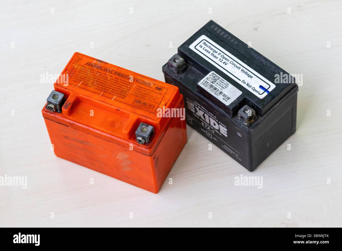 Two old, maintenance-free motorcycle batteries. Used, discarded acid ...
