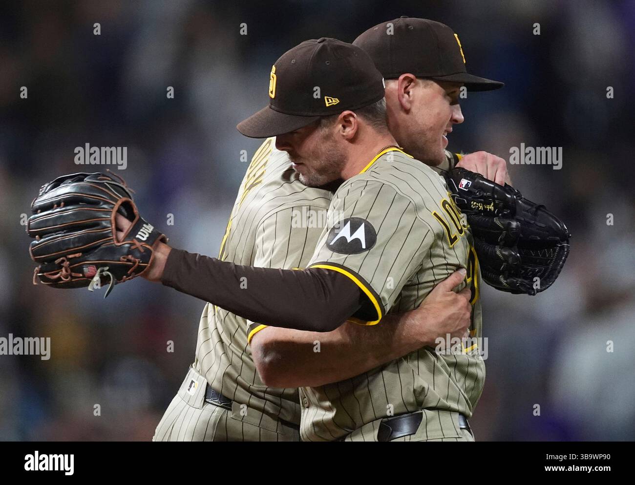 San Diego Padres left fielder Brandon Lockridge, front, hugs San Diego ...