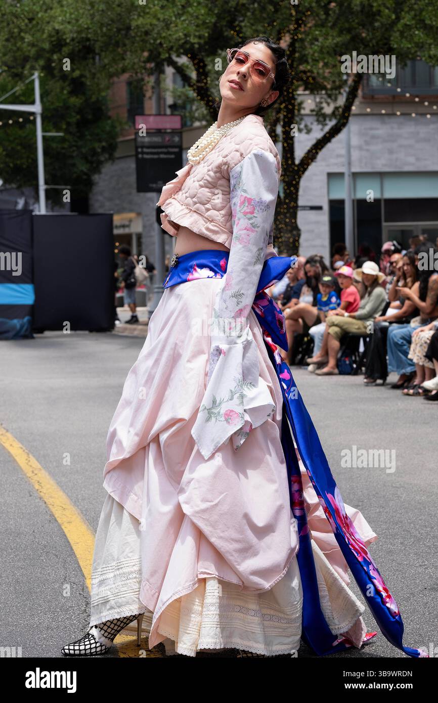 The Domain. 10th May, 2025. A model walks the runway during Austin ...