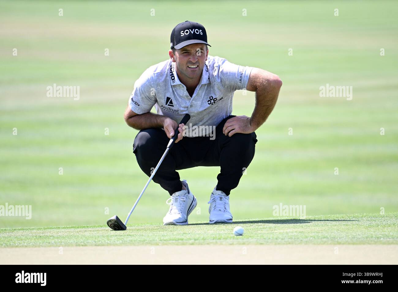 Denny McCarthy lines up his putt on the second green during the third ...