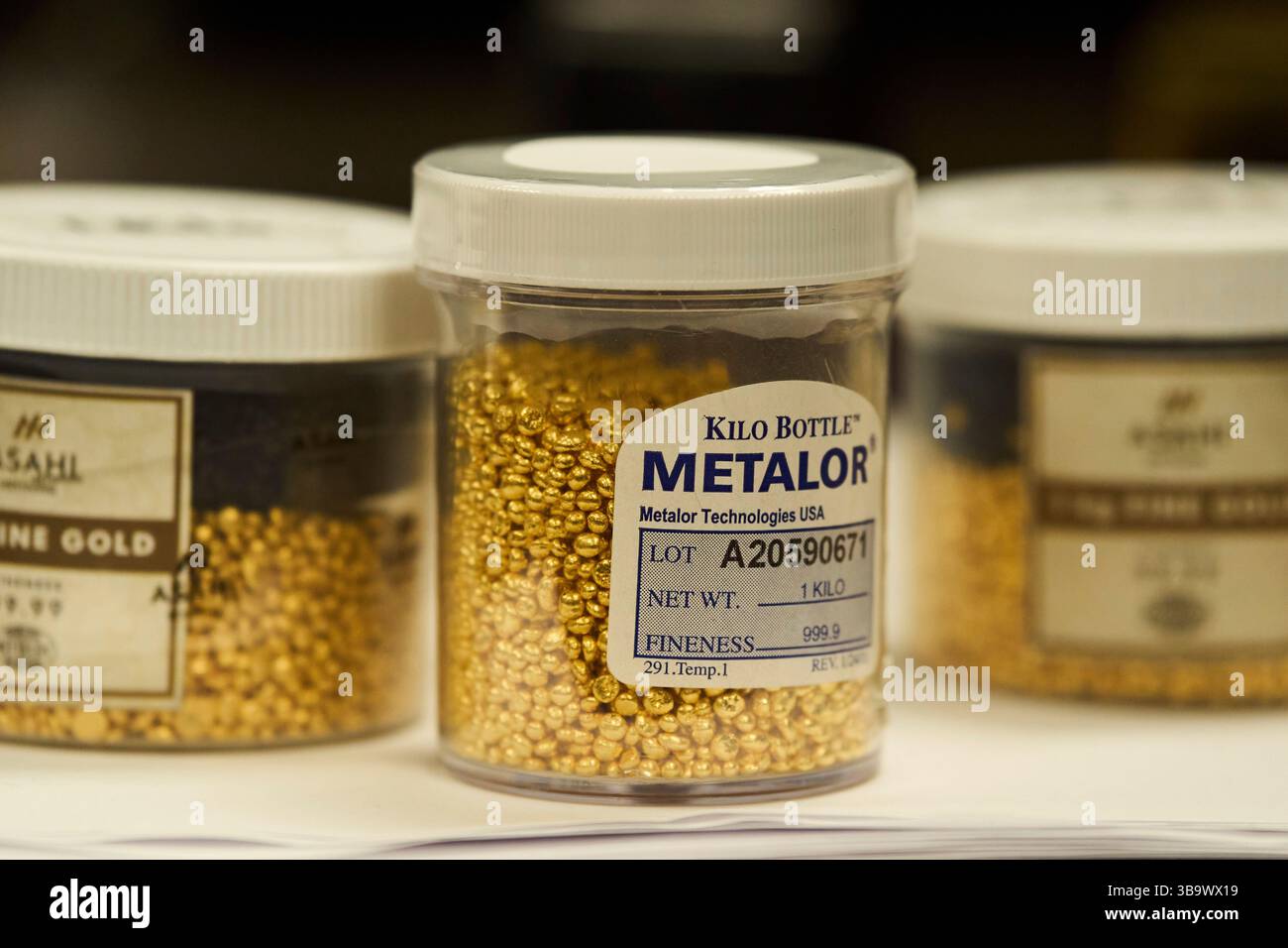 Containers holding gold granules are seen at A&M Precious Metals in the ...