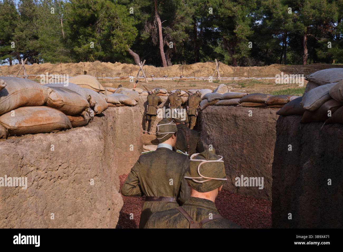 Turkish troops, looking on while comrades shoot at the enemy over the ...