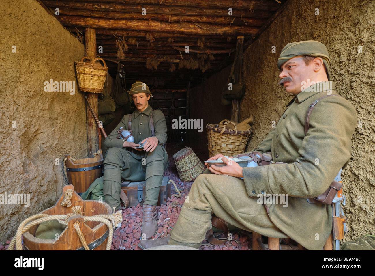 Turkish troops, sitting and eating and resting in a covered trench area ...