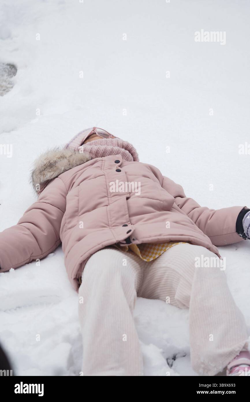 Child plays joyfully fresh snow hi-res stock photography and images - Alamy