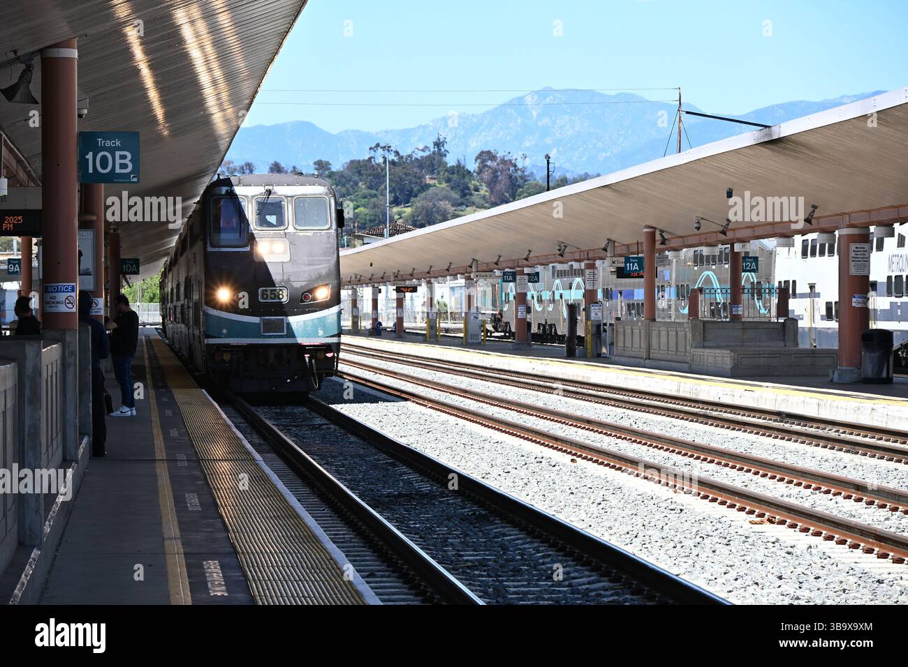 LOS ANGELES, CALIFORNIA - 9 MAY 2025: Metro Link train arriving at the platform at Union Station ...