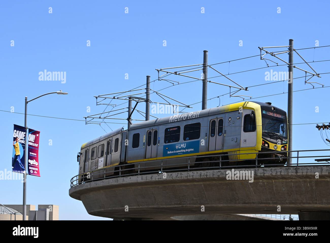 LOS ANGELES - 9 MAY 2025: Metro Rail train on overpass, an urban ...