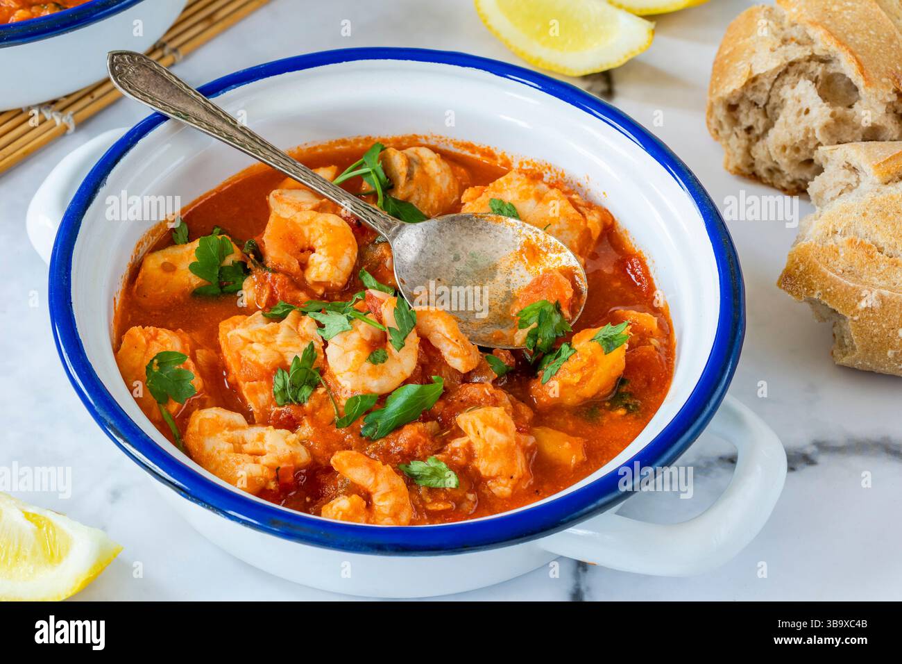 Fish stew made of cod, salmon, smoked haddock and prawns Stock Photo ...