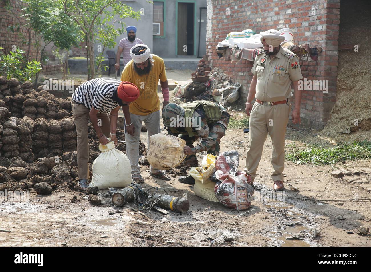 Missile debris found in Amritsar, India Villagers and an Indian Army ...