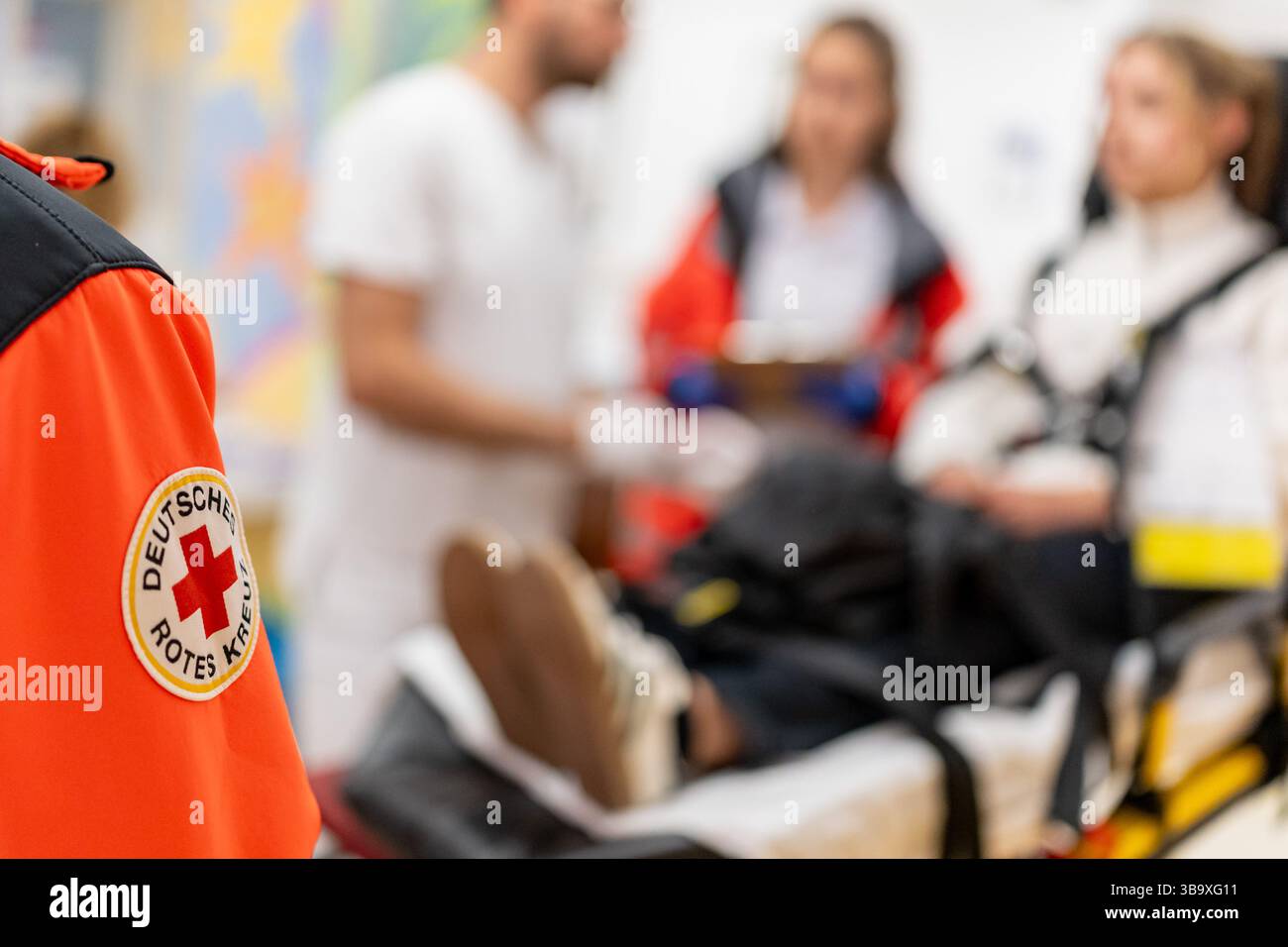 10 May 2025, Bavaria, Erlangen: The badge of the German Red Cross can ...