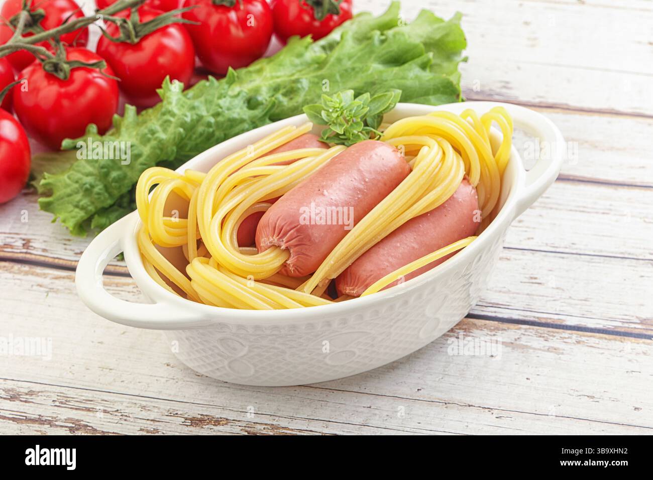 Mini sausages with pasta spaghetti for kids Stock Photo - Alamy