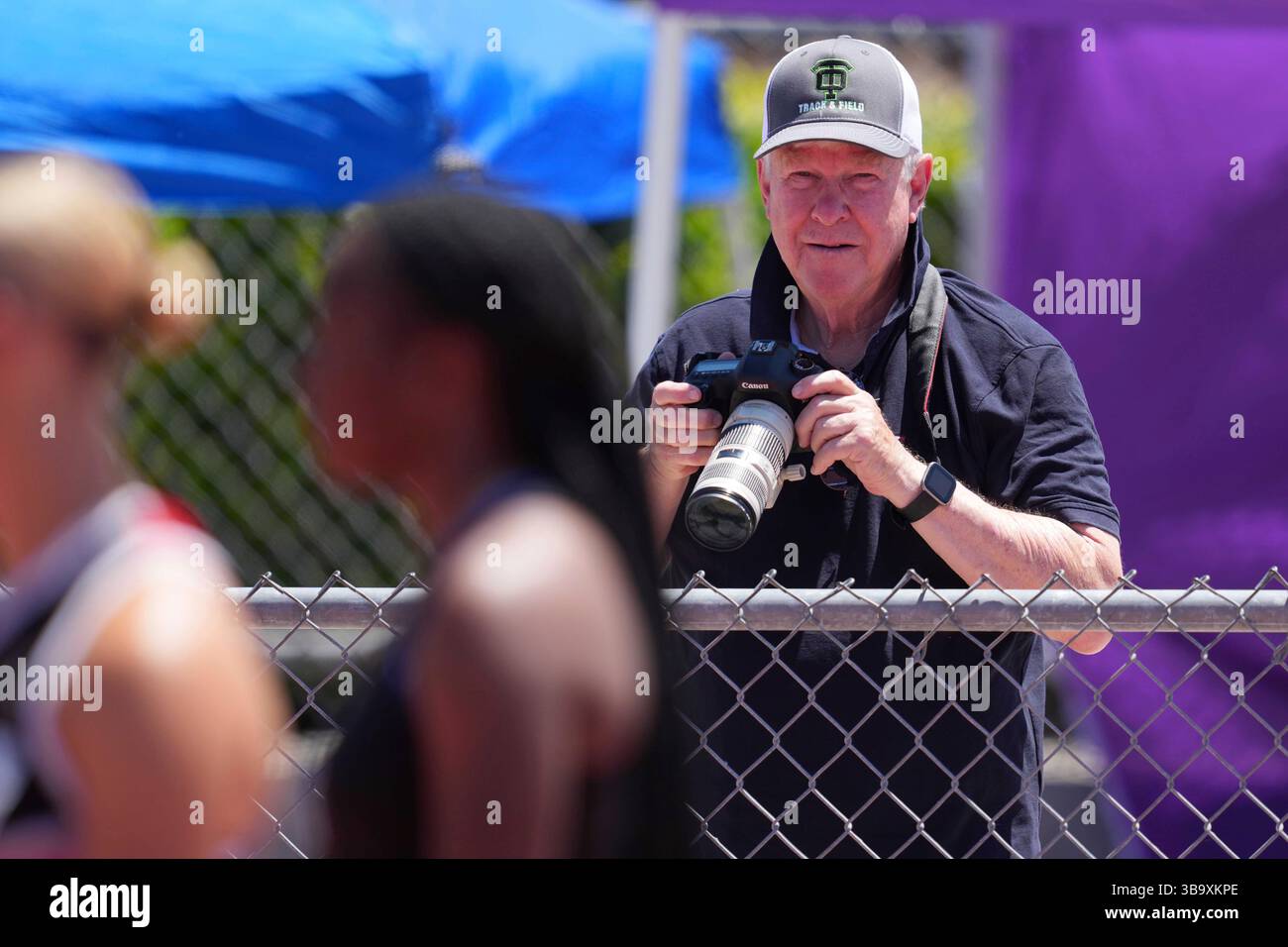 Larry Wilcox takes photographs during the CIF Southern Section Division ...