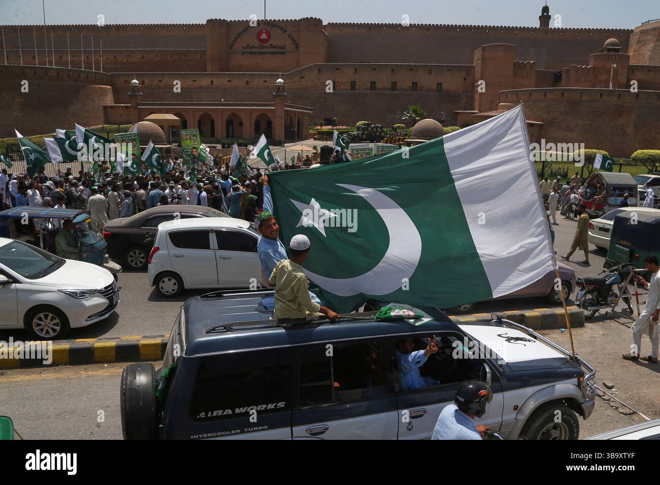 People with national flags take part in a demonstration to show their ...