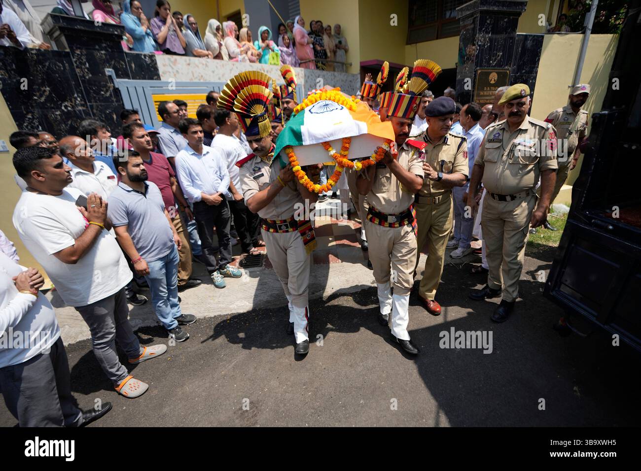 Police personnel carry the casket containing the body of Raj Thapa, a senior bureaucrat who was ...