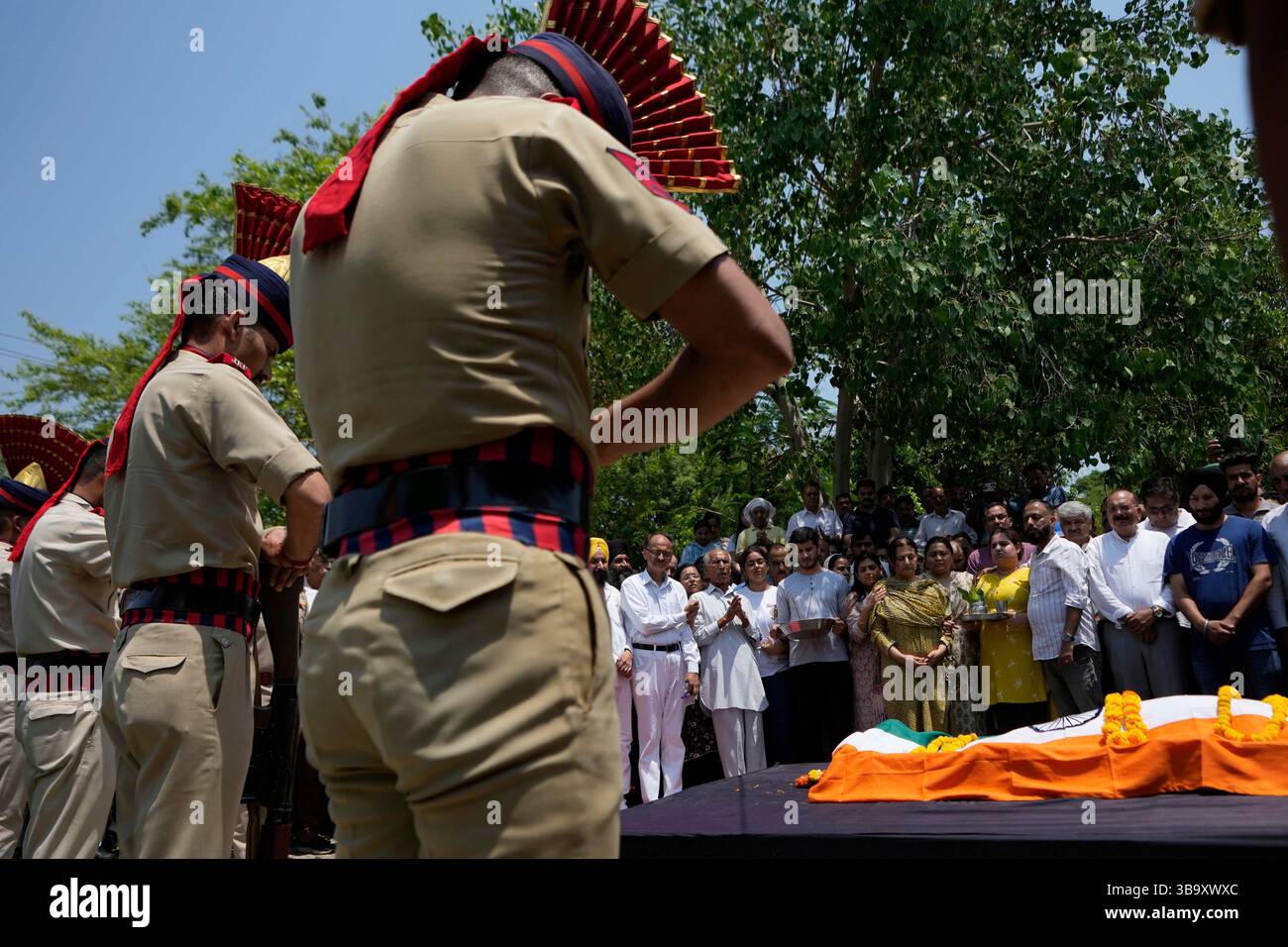 Police personnel pay tribute to Raj Thapa, a senior bureaucrat who was ...