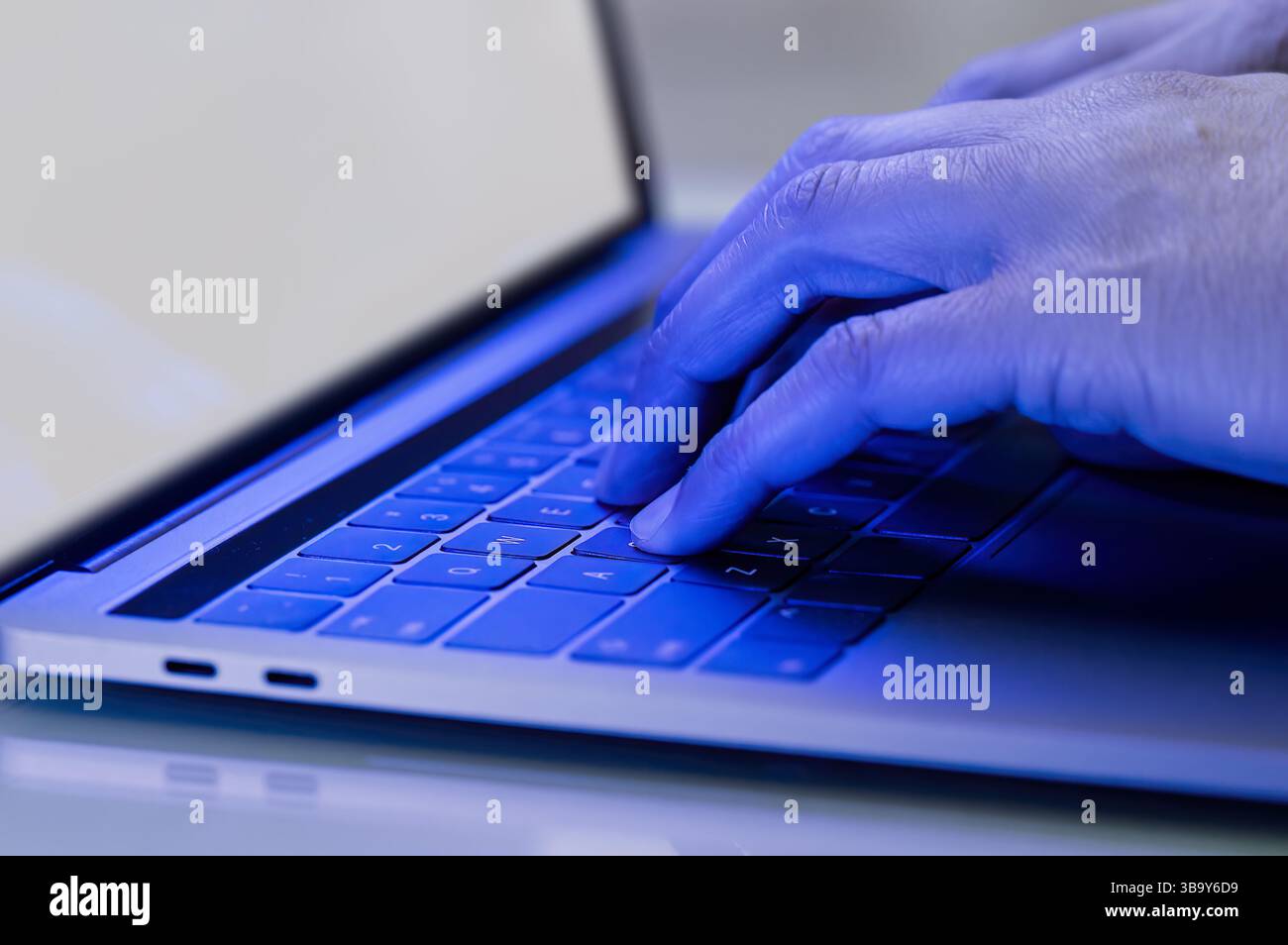 Hes got his finger on the trigger.An unrecognizable male gamer playing ...